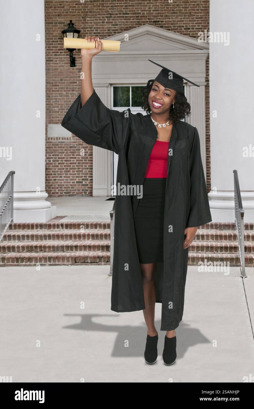Young black african American woman in her graduation robes Stock Photo ...