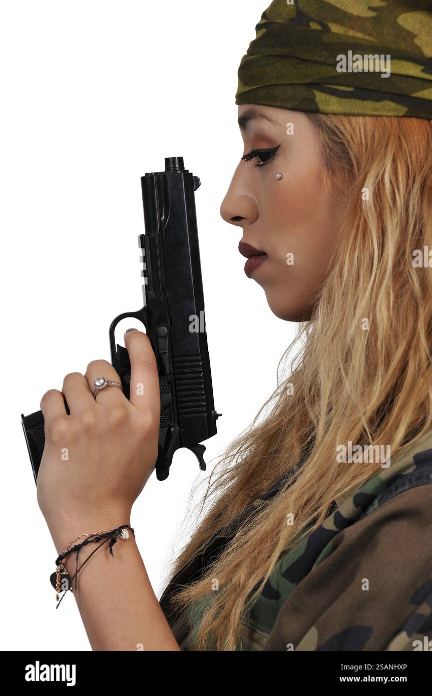 Gun toting beautiful young woman soldier with a pistol Stock Photo - Alamy