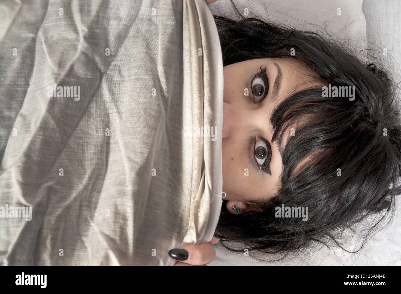 Woman waking up from a nightmare or night terror Stock Photo - Alamy