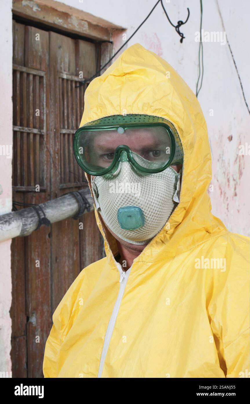 Man wearing a hazmat suit in the face of infectious disease Stock Photo ...