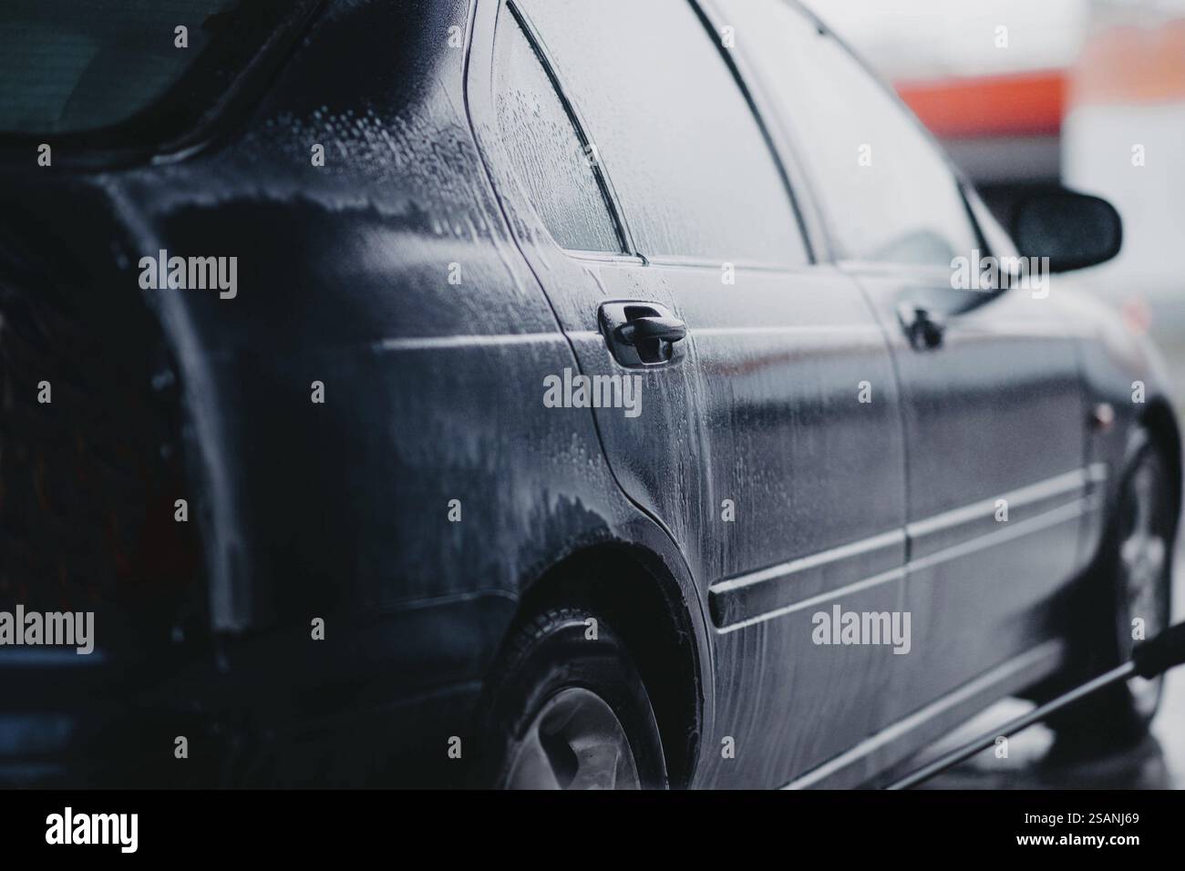 A wet car body being cleaned at a car wash Stock Photo - Alamy