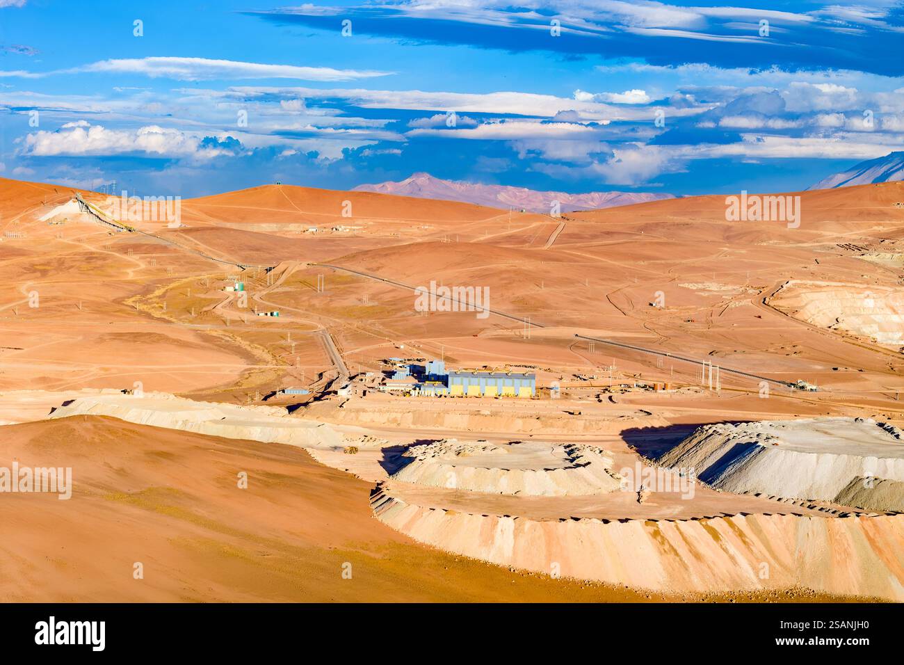 Aerial view of a long conveyor belt at copper mine in the altiplano of ...