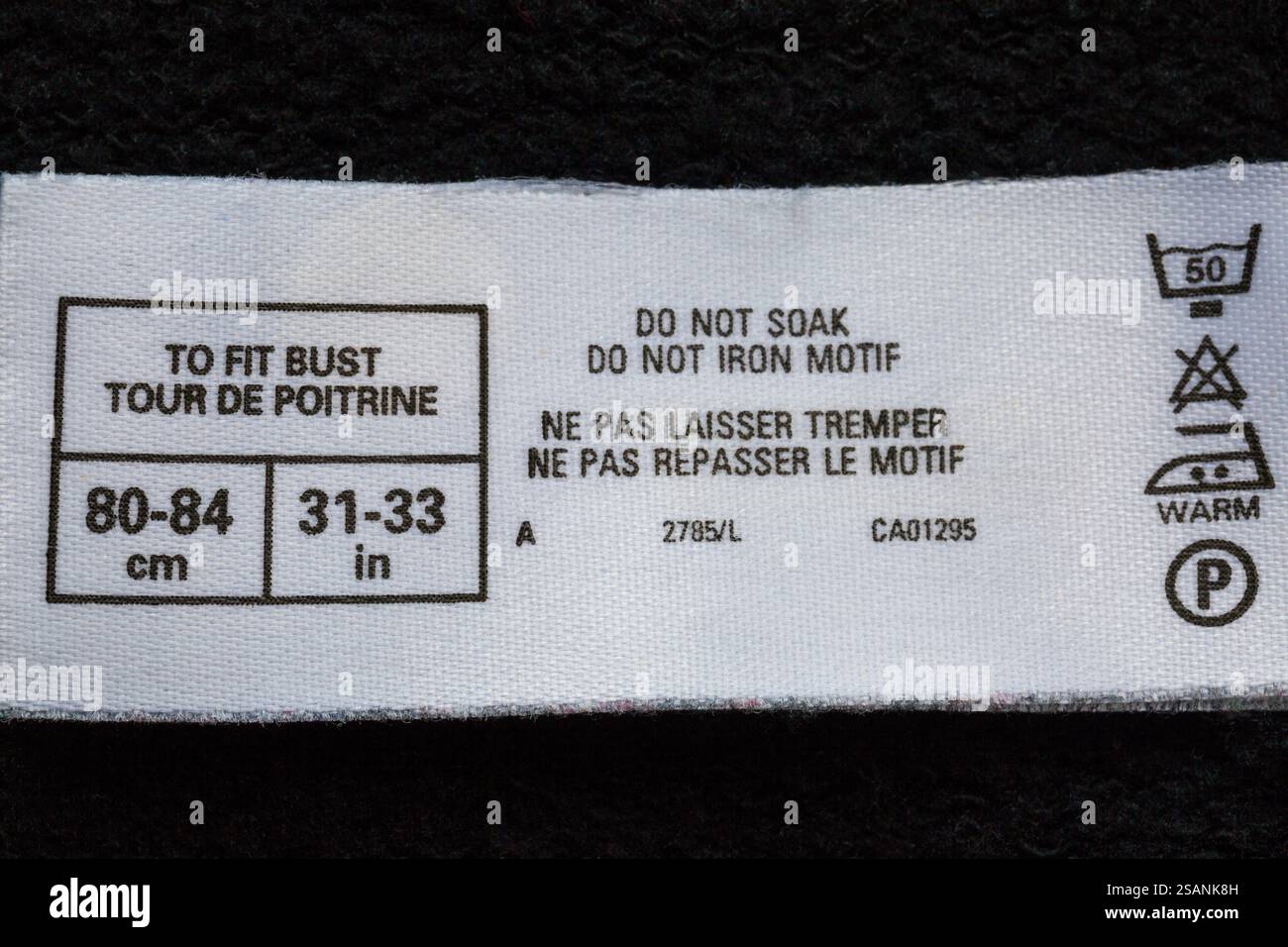 label with washing instructions in jumper - care washing symbols and ...