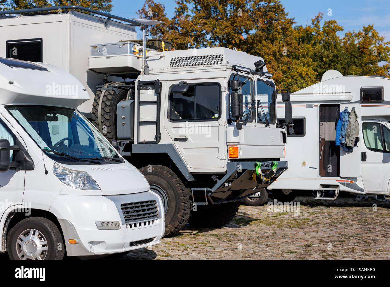 Big off-road expedition truck parked many white modern campervan ...