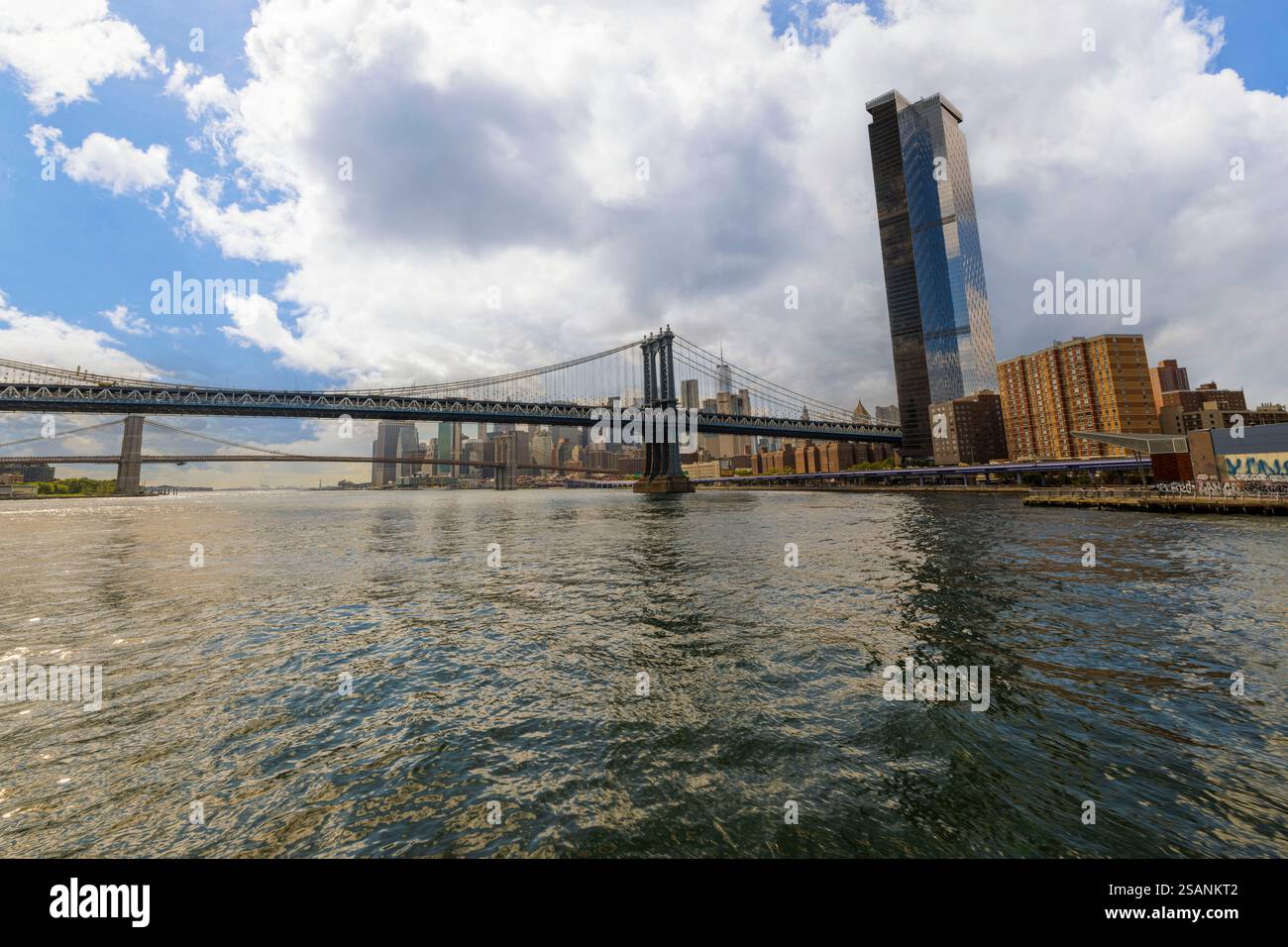 Manhattan Bridge spanning East River with Lower Manhattan skyline. New ...