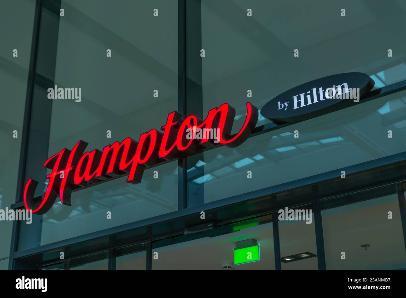 Hampton by Hilton hotel sign. Logo is reflecting in the window Stock ...