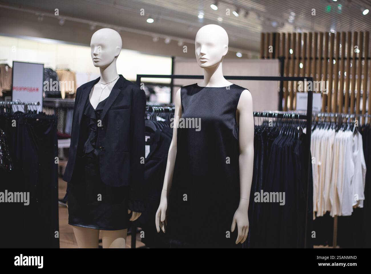 Mannequin in stylish clothes in a store Stock Photo - Alamy