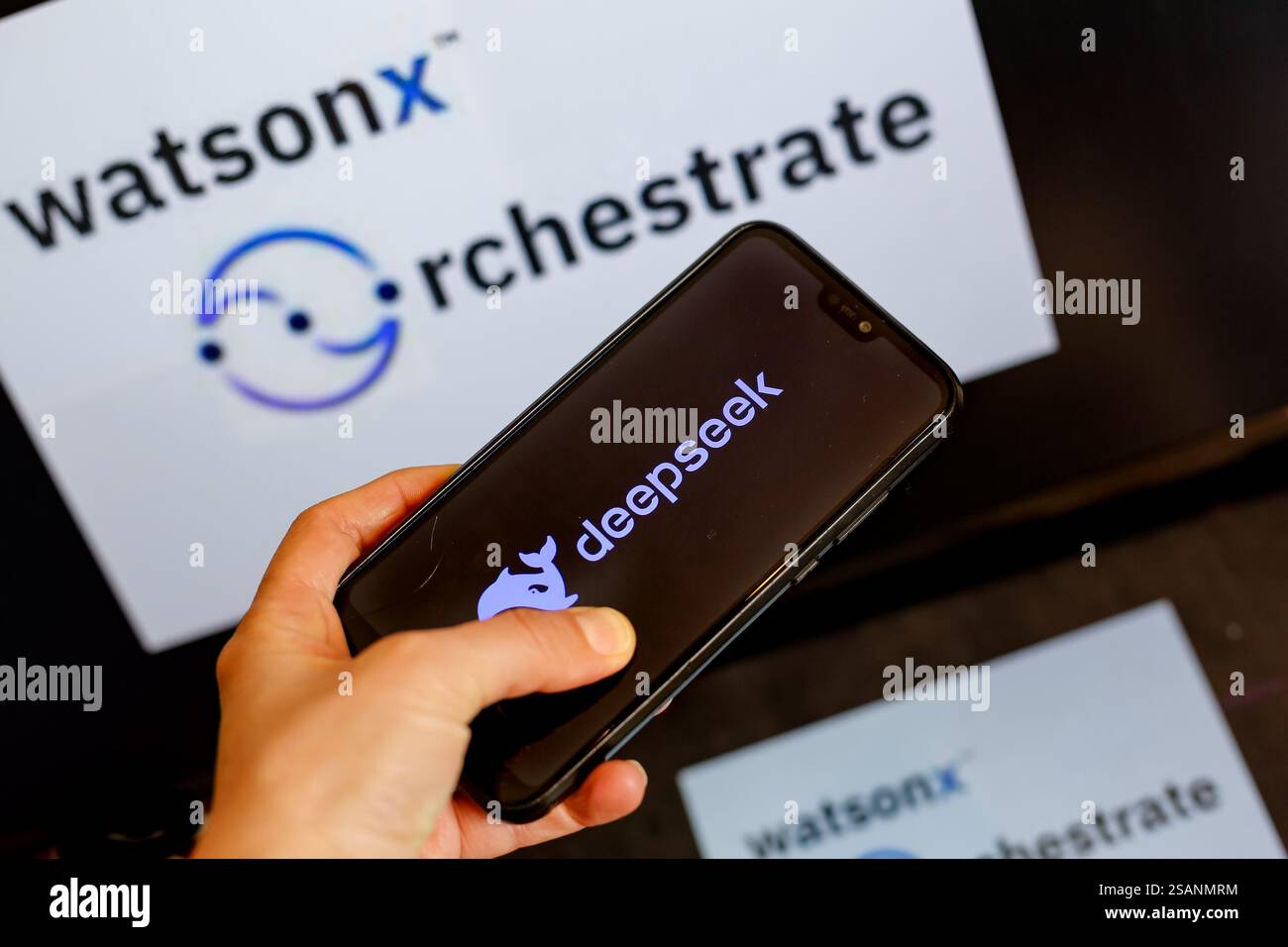 In this photo illustration the Watson Orchestrate logo, A.I product by ...