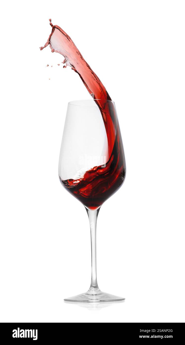 Red wine splashing in glass on white background Stock Photo - Alamy