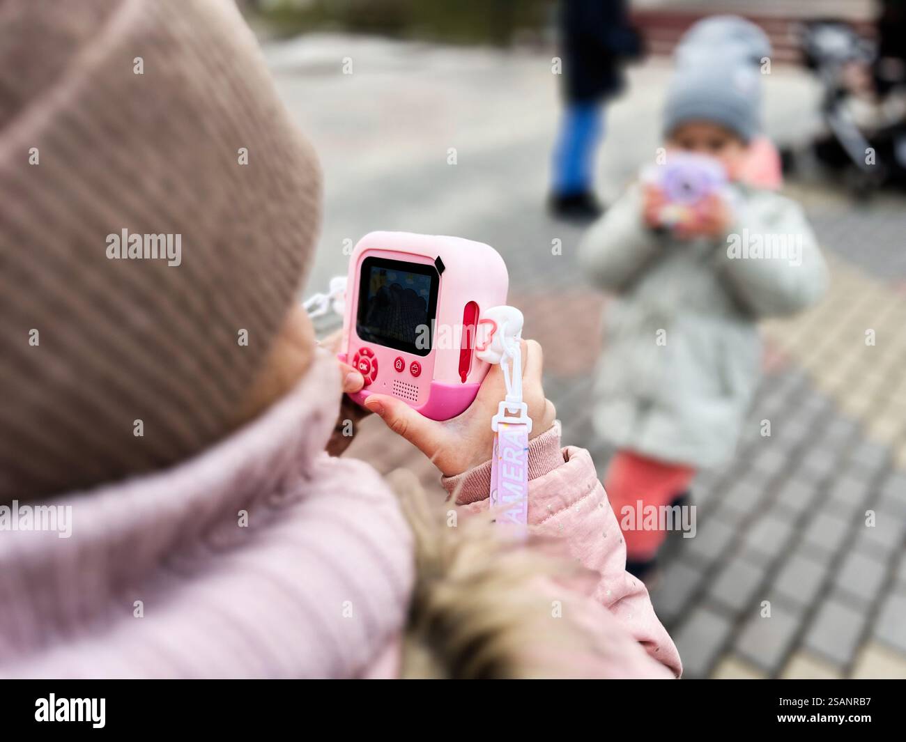 Children capturing photos with playful toy cameras in an outdoor ...
