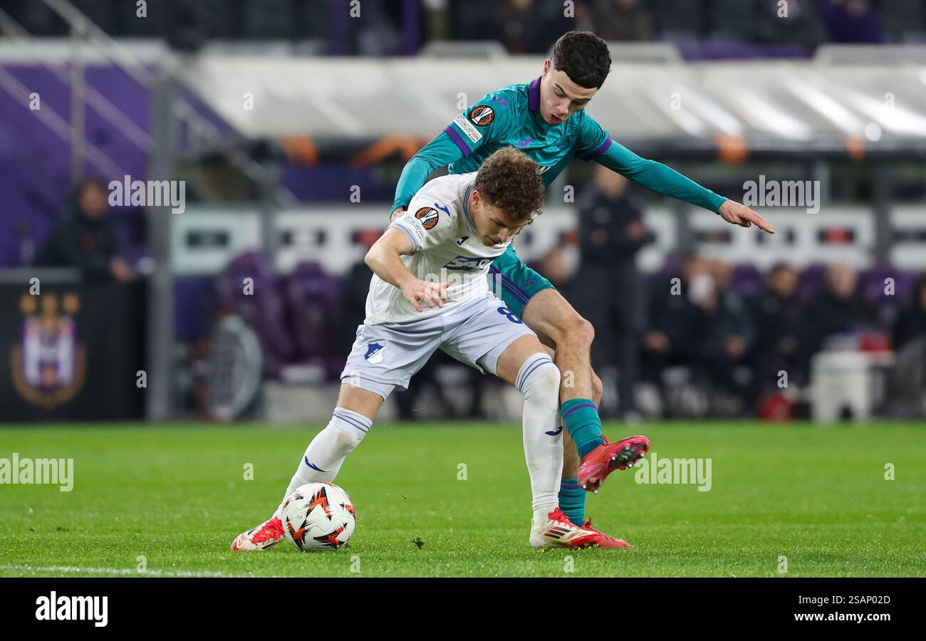 Brussels, Belgium. 30th Jan, 2025. Hoffenheim's Dennis Geiger and Anderlecht's Tristan Degreef ...