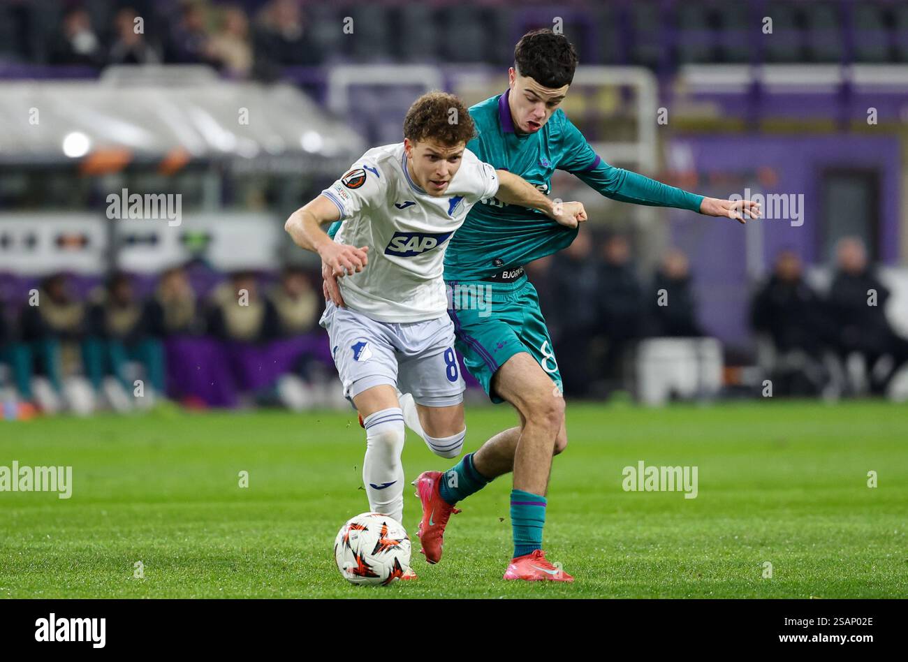 Brussels, Belgium. 30th Jan, 2025. Hoffenheim's Dennis Geiger and Anderlecht's Tristan Degreef ...