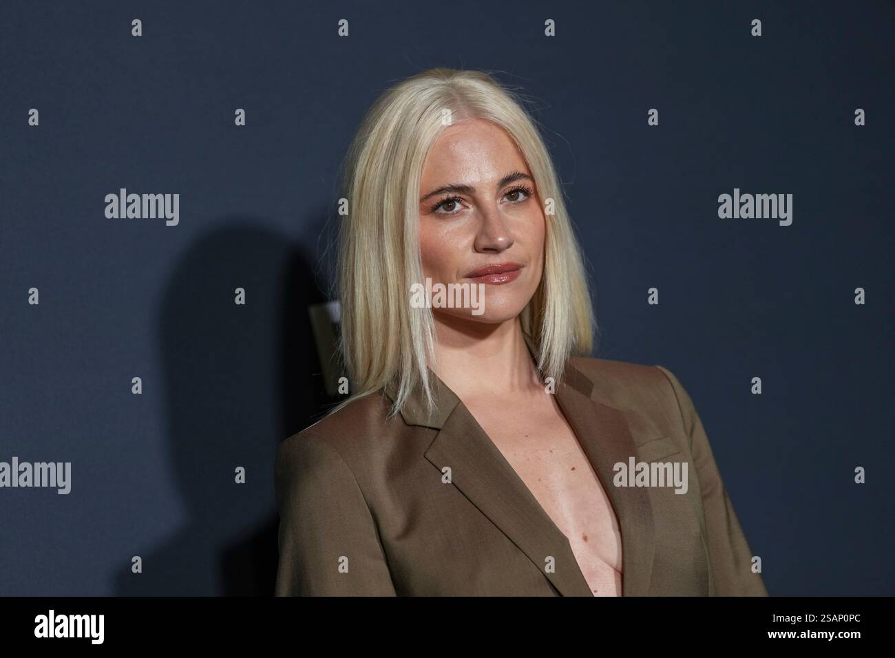 Pixie Lott pose for photographers upon arrival at the BOSS One x David ...