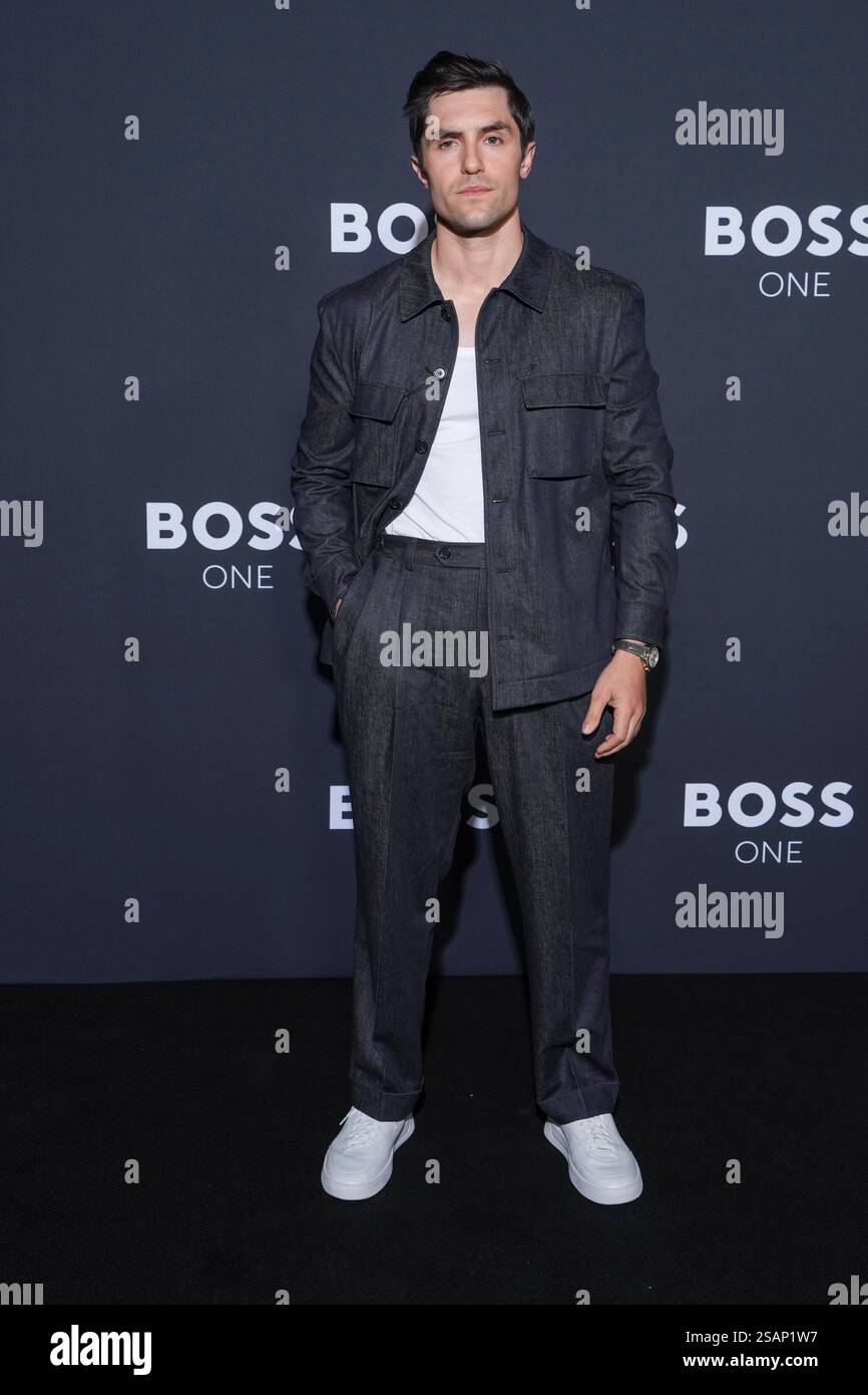 Phil Dunster poses for photographers upon arrival at the BOSS One x ...