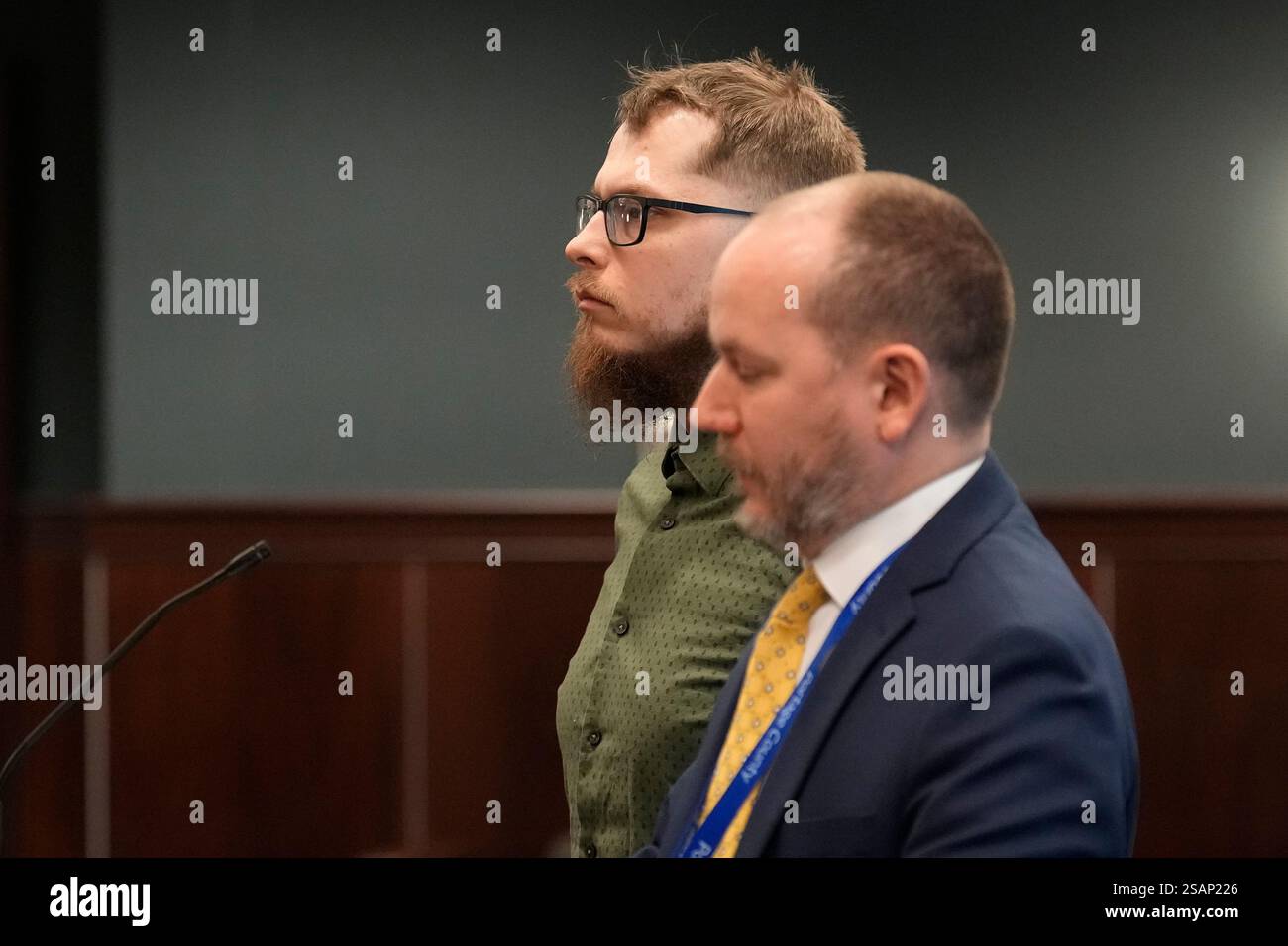 Nicholas Fontaine, left, stands with his attorney, assistant public ...