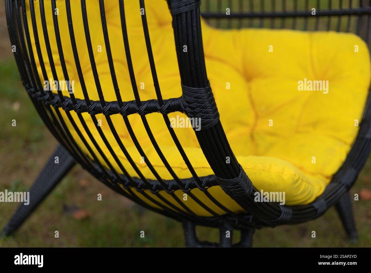 yellow cocoon armchair on the lawn Stock Photo - Alamy