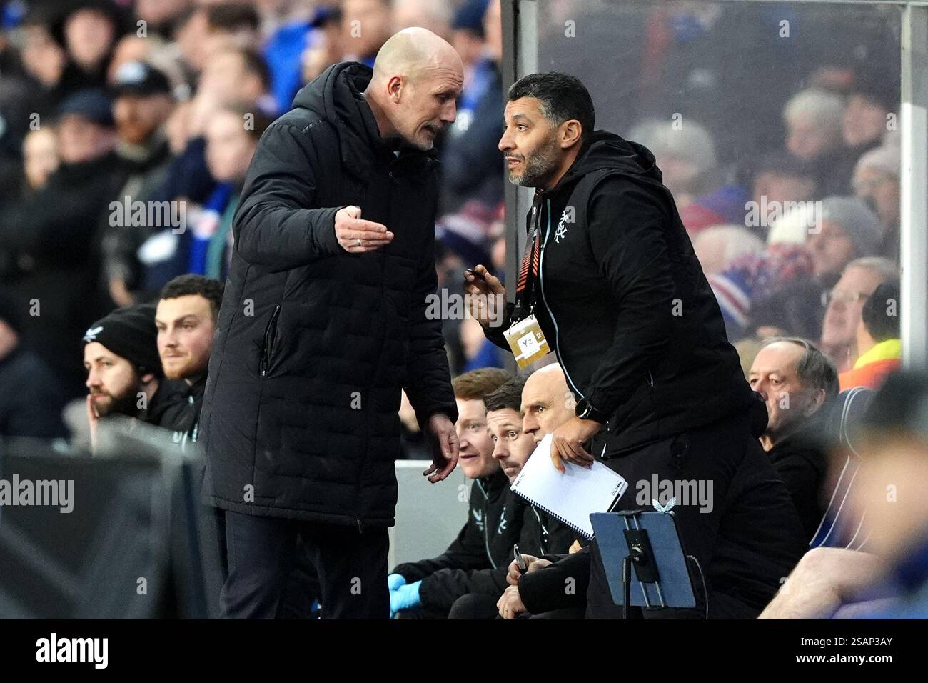 Rangers manager Philippe Clement (left) speaks with assistant manager ...