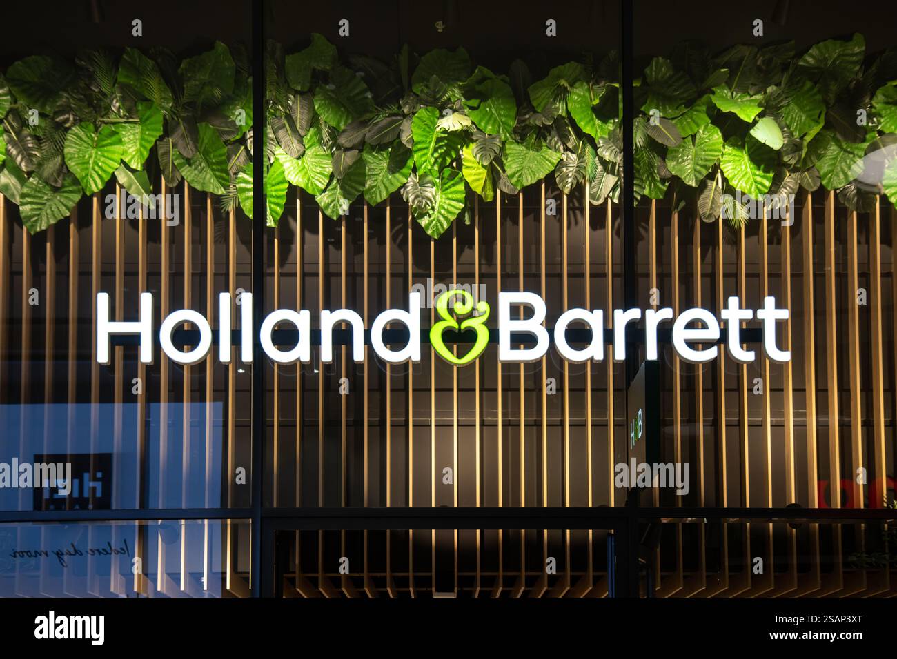 Holland & Barrett logo sign on the front shop. A retail chain health ...