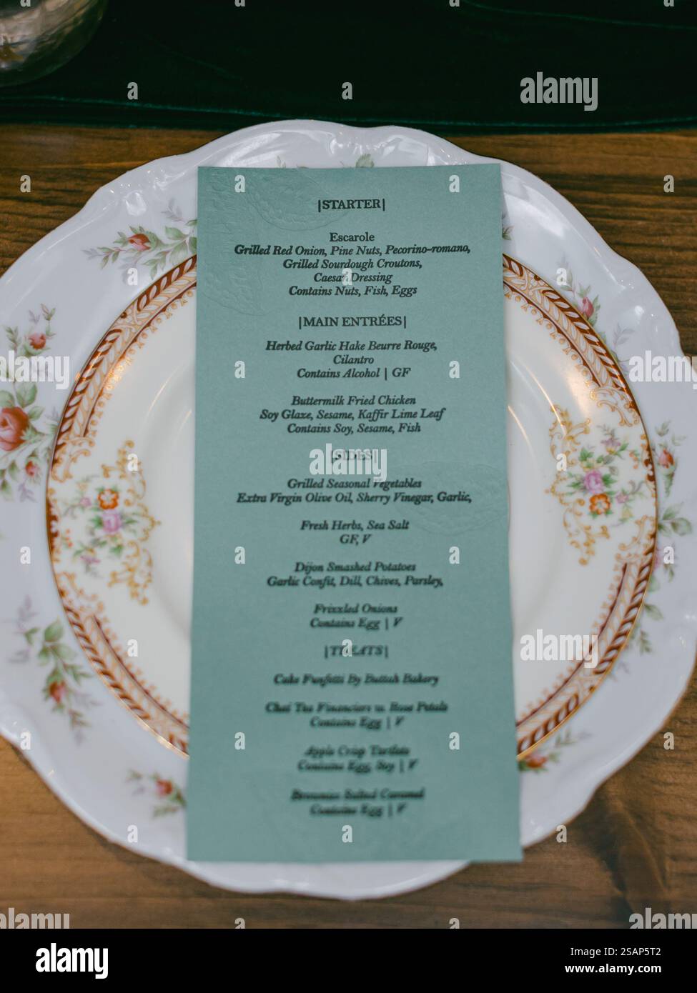 A beautifully arranged table displays a gourmet menu featuring various ...