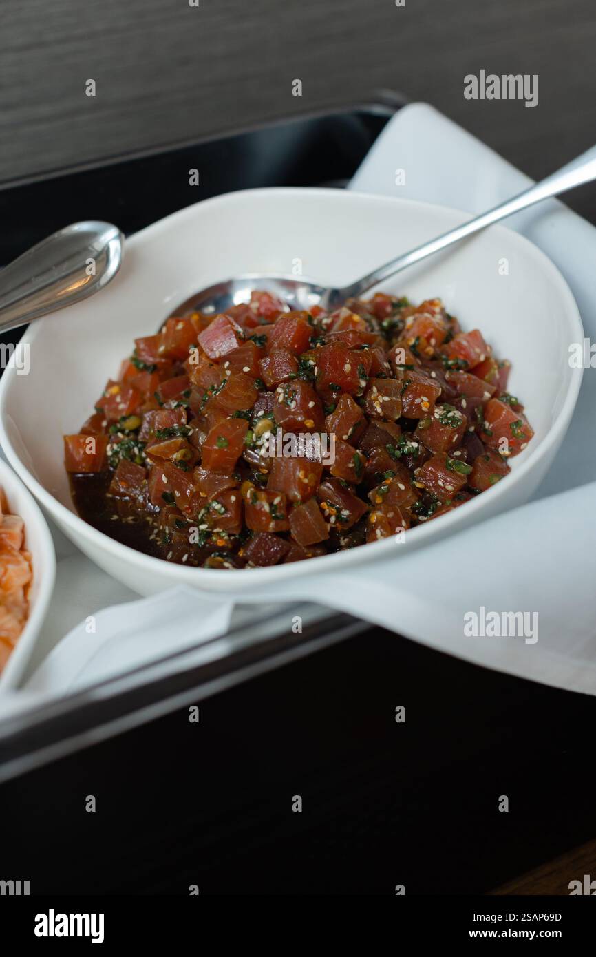 Colorful salsa featuring diced tomatoes and herbs is presented in a ...