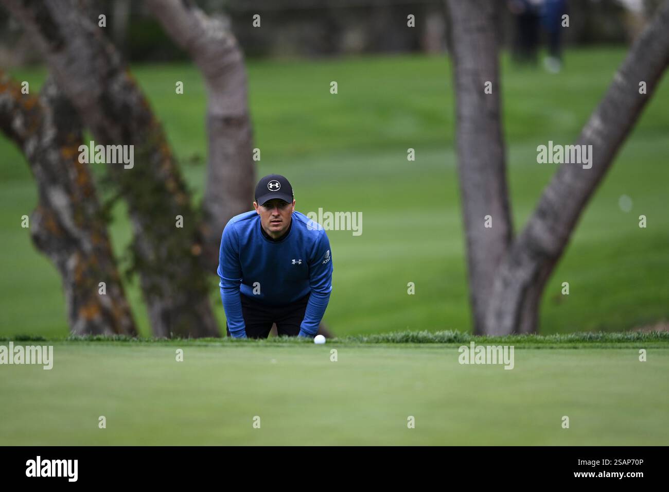 Jordan Spieth lines up a putt on the 15th hole at Spyglass Hill Golf ...