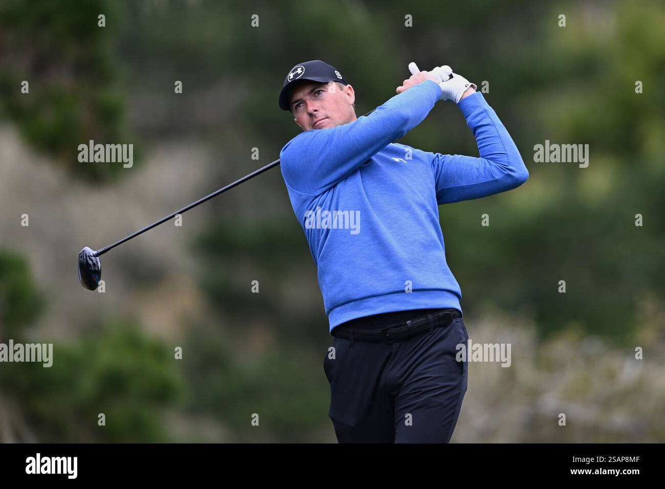 Jordan Spieth tees off on the 17th hole at Spyglass Hill Golf Course ...