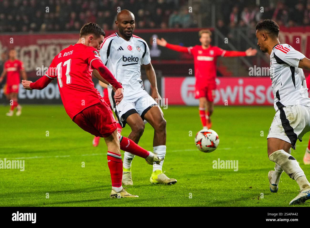 Twente's Daan Rots, left, attempts a shoot at goal against Besiktas ...