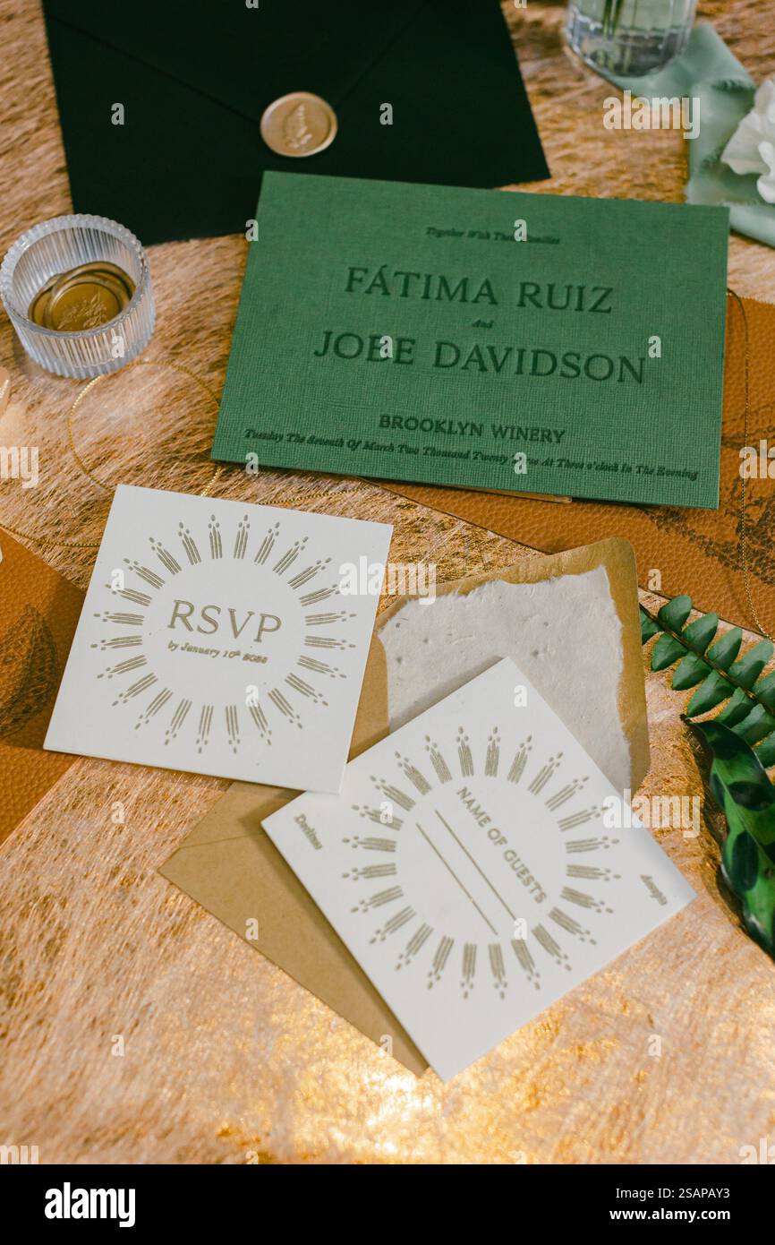 Colorful wedding invitations are beautifully arranged on a decorative ...