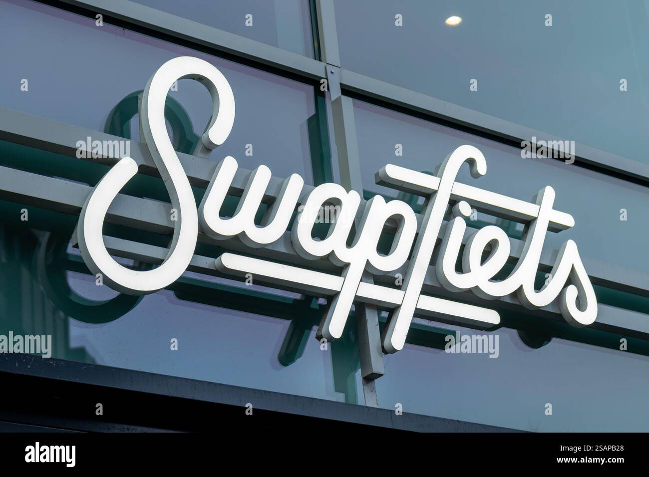 Swapfiets Flagship bike Store, shop logo sign above the entrance Stock Photo - Alamy