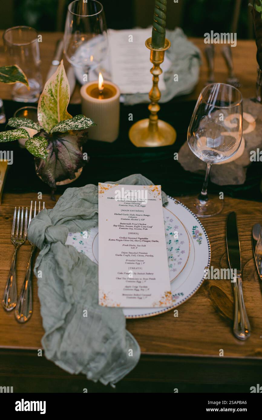 A beautifully arranged dinner table features an elegant place setting ...