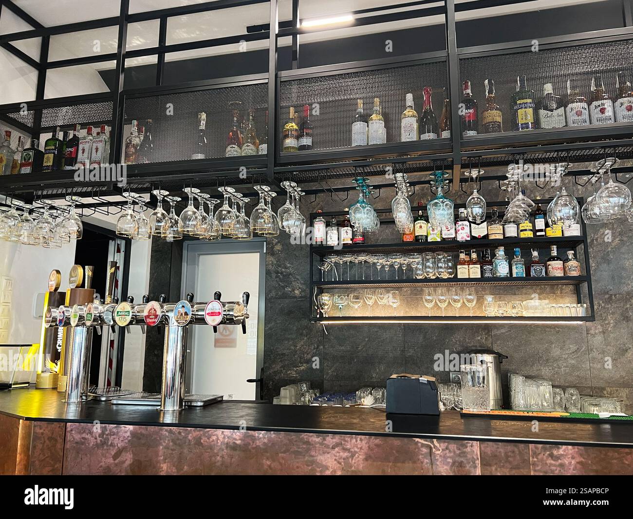 Kyiv, Ukraine - January 30, 2025: A stylish bar interior featuring a ...