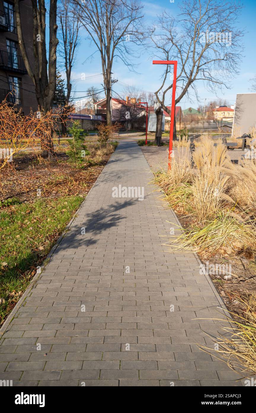 Walking path, paved with tiles Stock Photo - Alamy