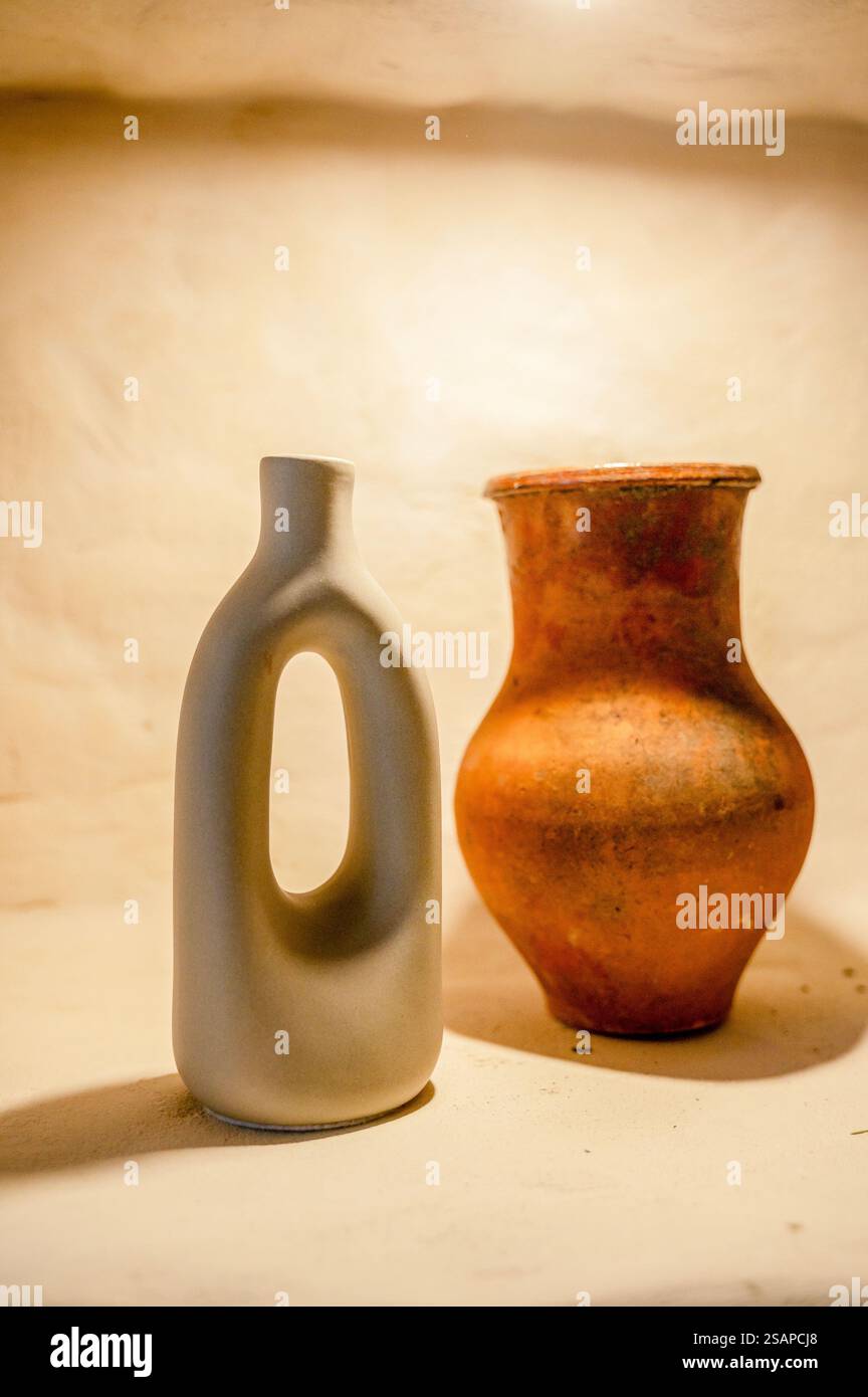 handmade clay pottery in an arch with backlight Stock Photo - Alamy