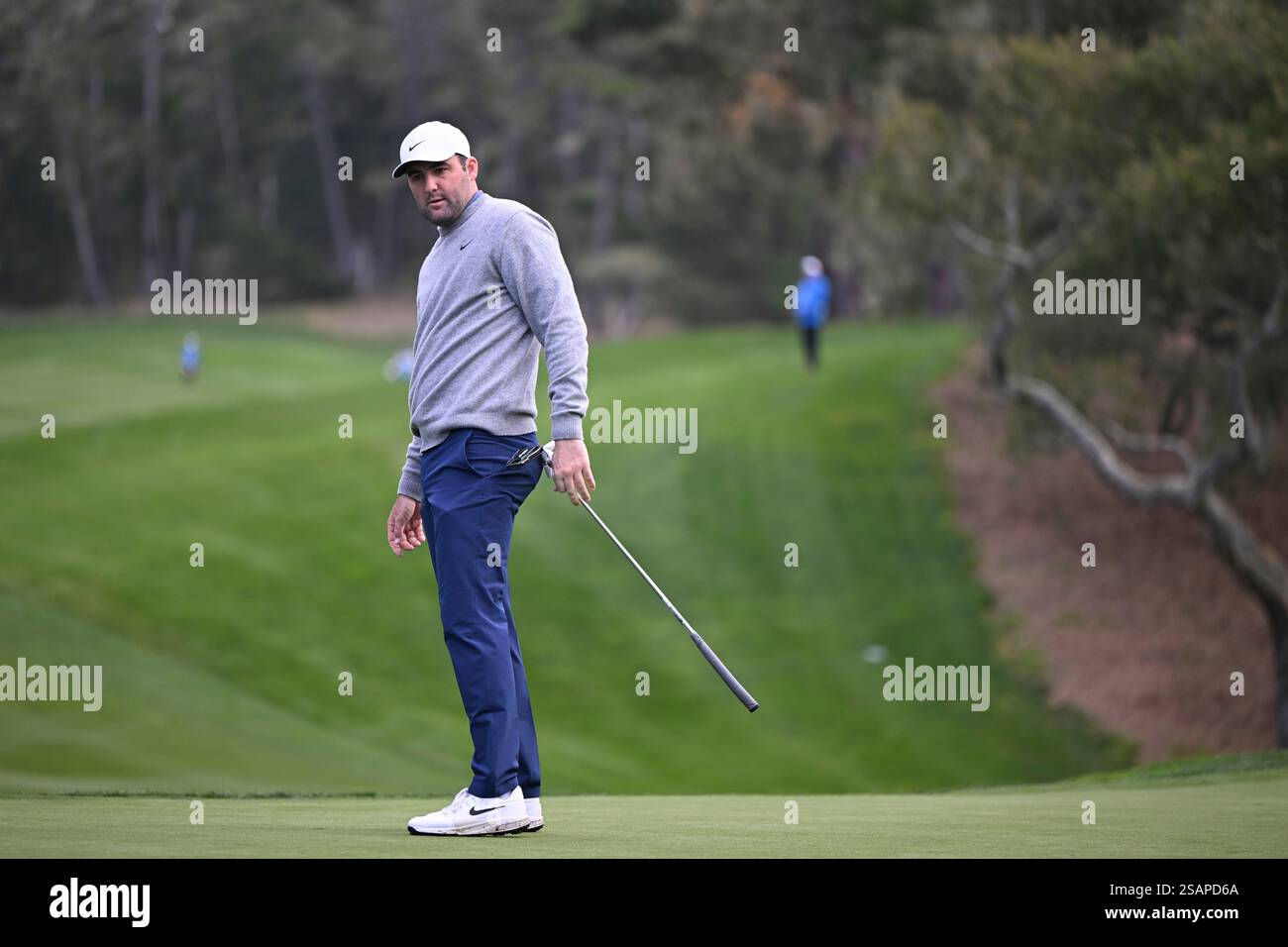 Scottie Scheffler watches his putt on the 13th hole during the first ...