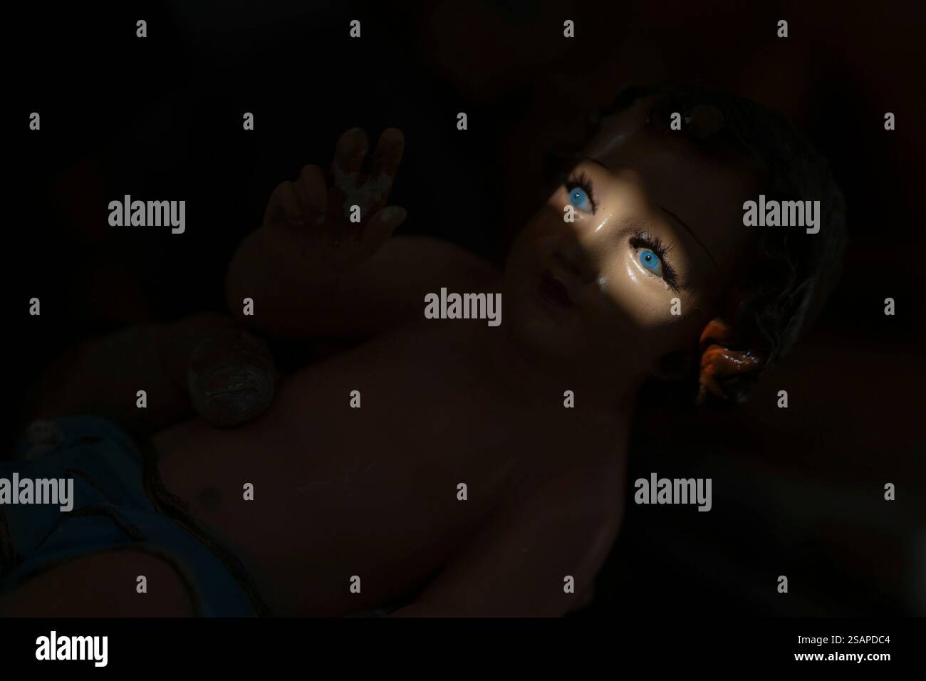 Julio Cesar repairs a figurine of Baby Jesus ahead of "Dia de la ...