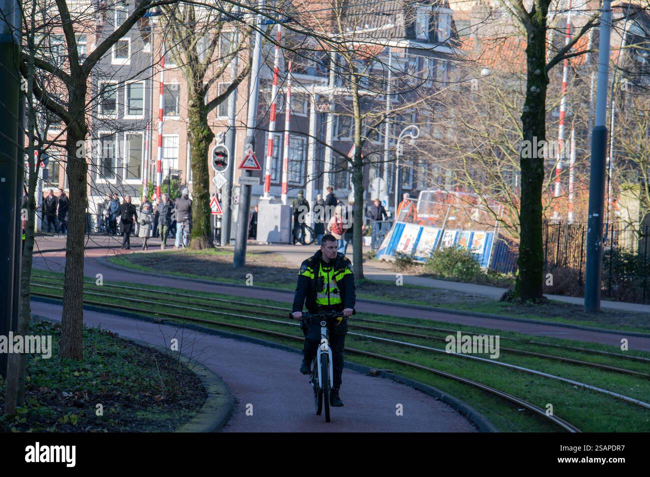 Police Officer On Bicycle At Amsterdam The Netherlands 26-1-2025 Stock ...