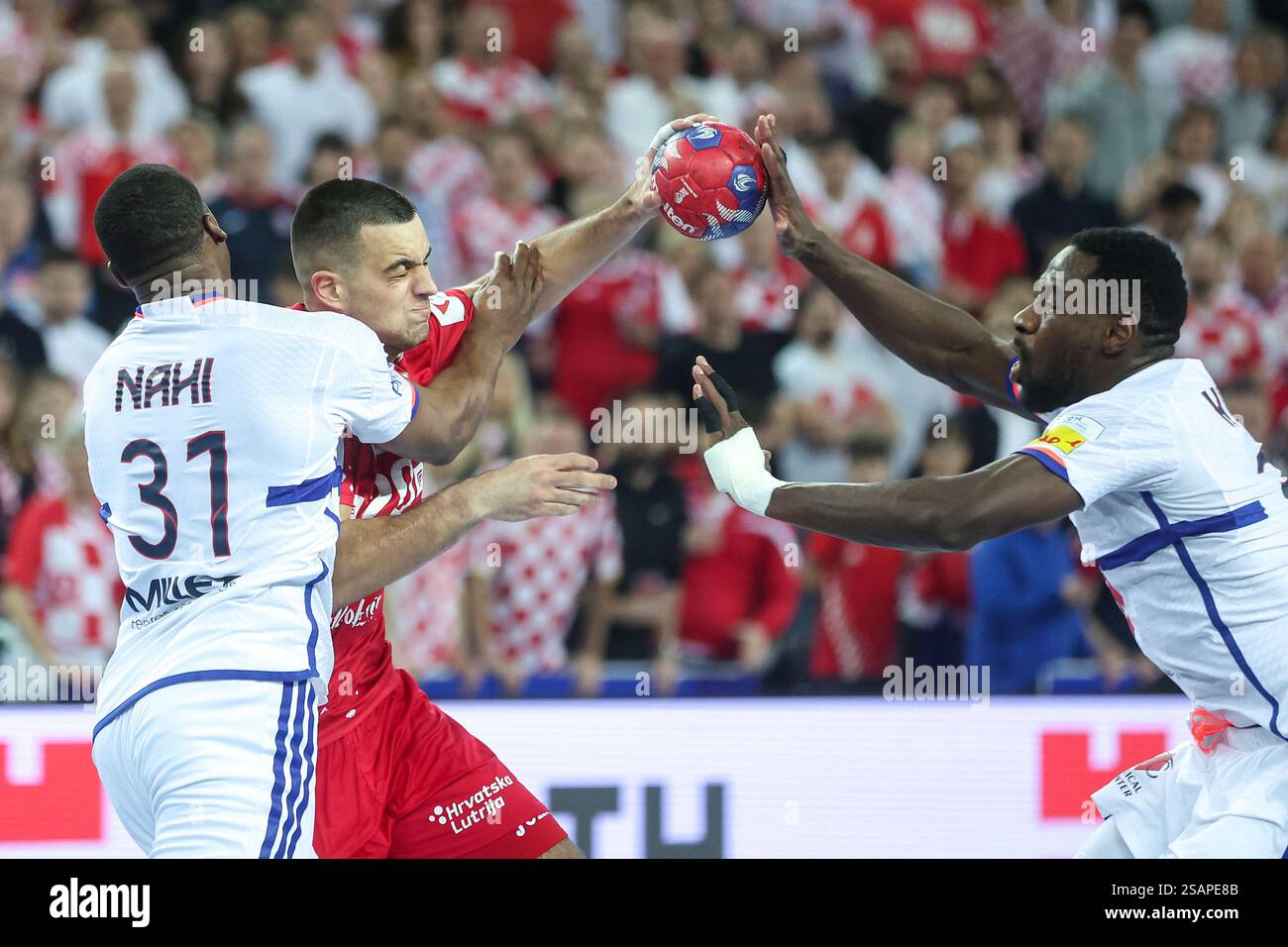 Zagreb, Croatia. 30th Jan, 2025. Mateo Maras of Croatia is challenged by Dylan Nahi and Karl ...