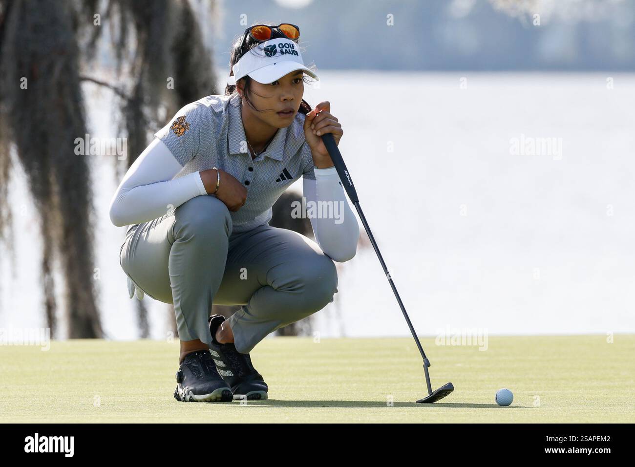 Patty Tavatanakit lines up putt on the 18th green during the first ...