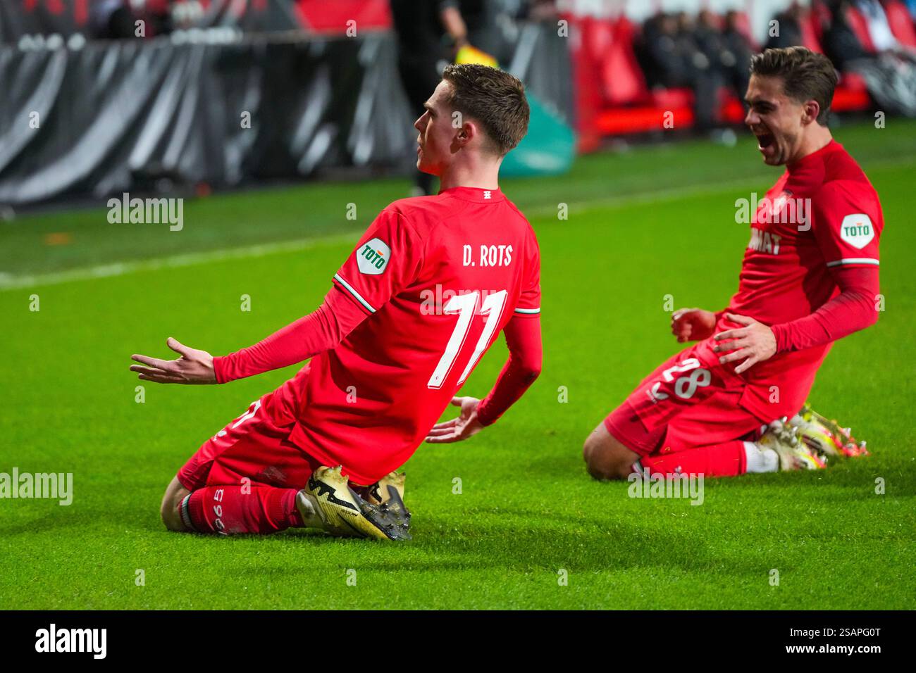 Twente's Daan Rots, left, celebrates with teammates after scoring the ...