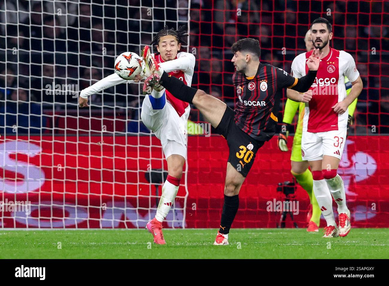 AMSTERDAM, NETHERLANDS - JANUARY 30: Yusuf Demir of Galatasaray AS kicks the ball, Kian Fitz-Jim ...