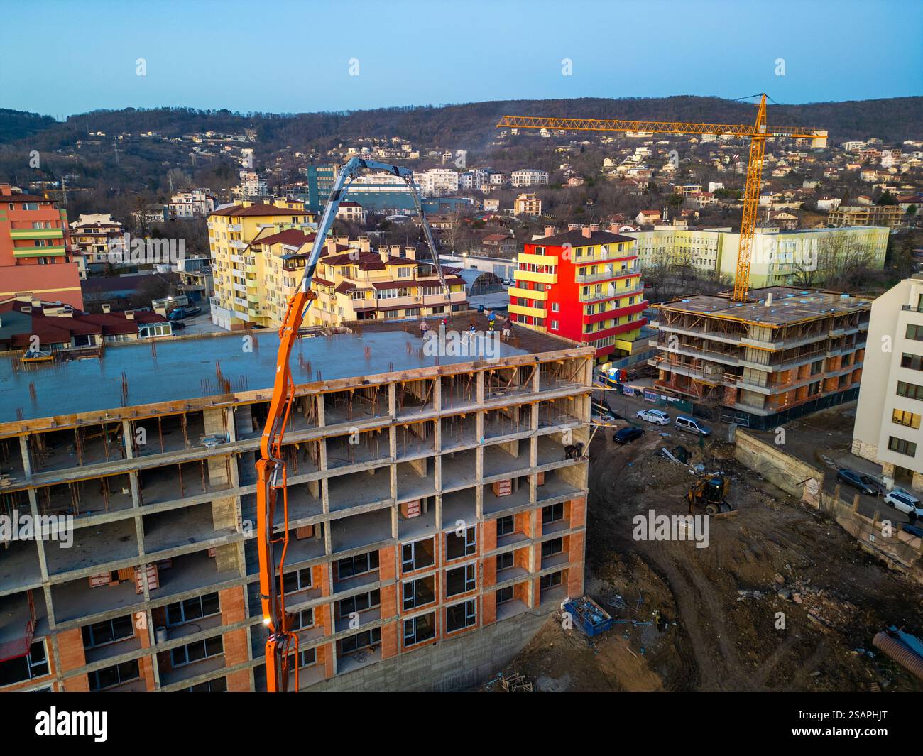 Aerial view of a construction site with a high-rise building under ...