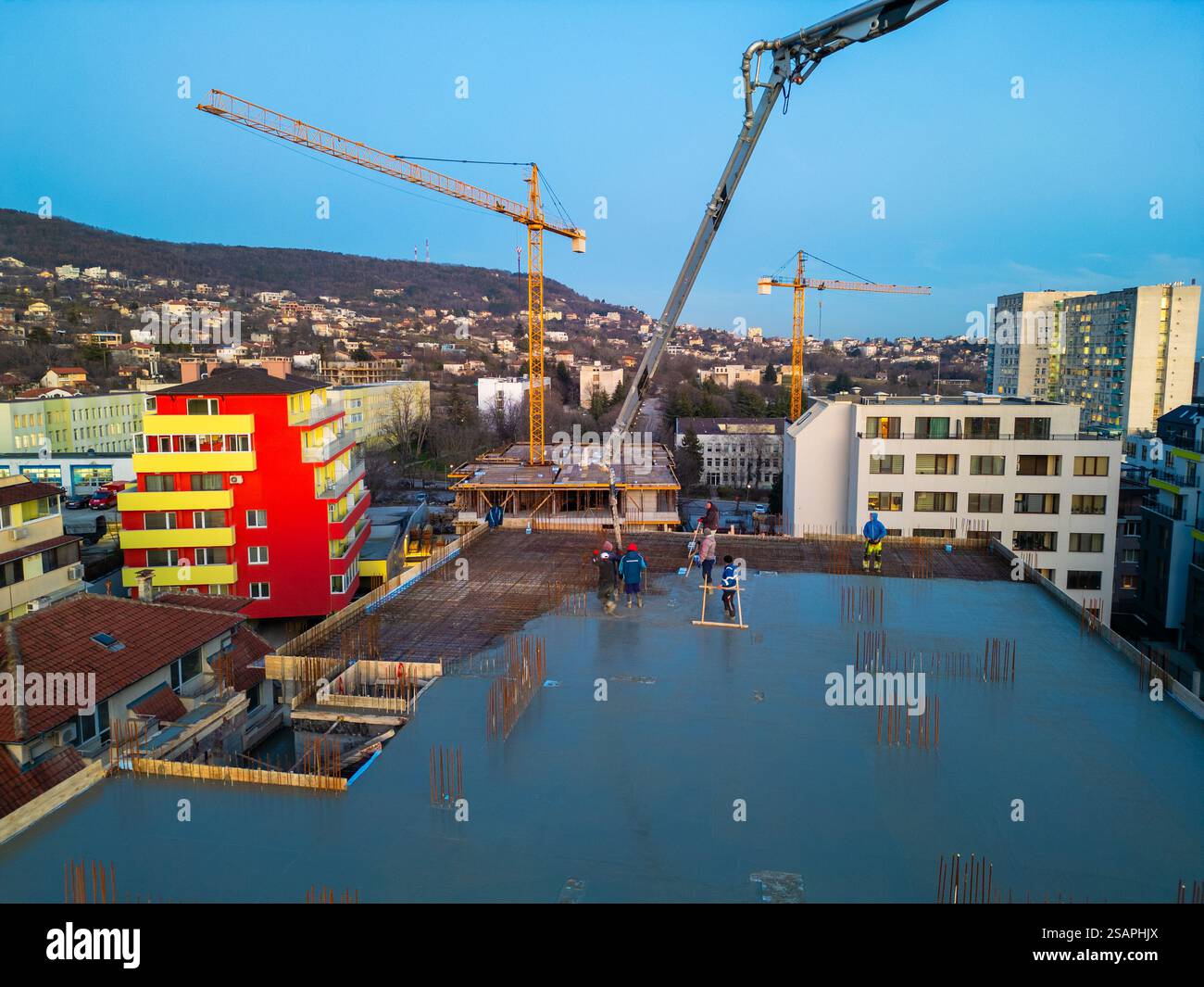 Aerial view of a construction site with a high-rise building under ...