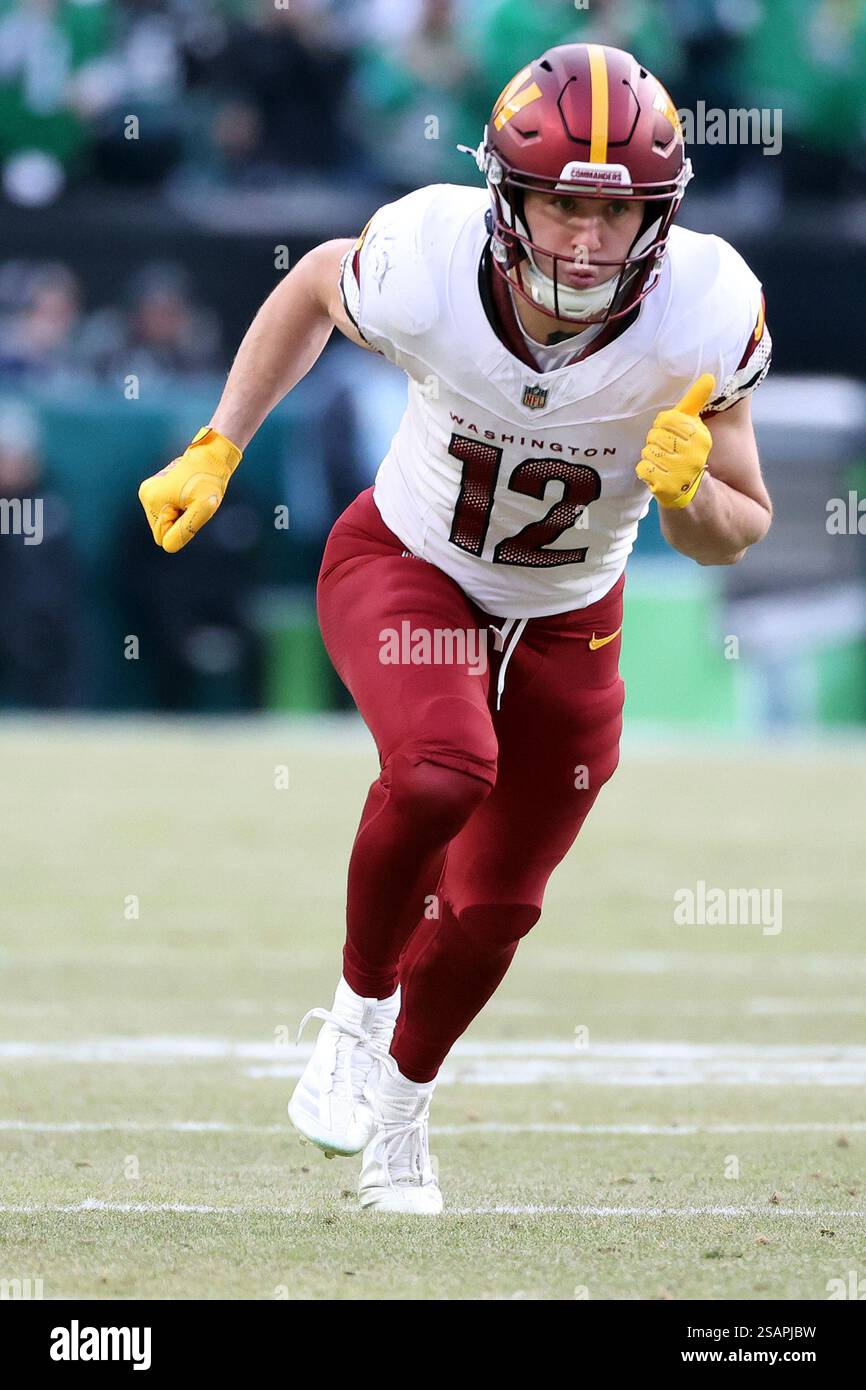Washington Commanders wide receiver Luke McCaffrey (12) runs a route ...