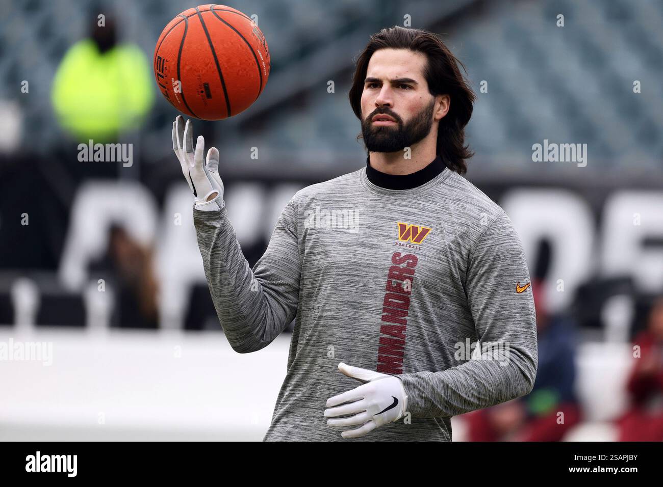 Washington Commanders quarterback Sam Hartman (15)warms up before the ...