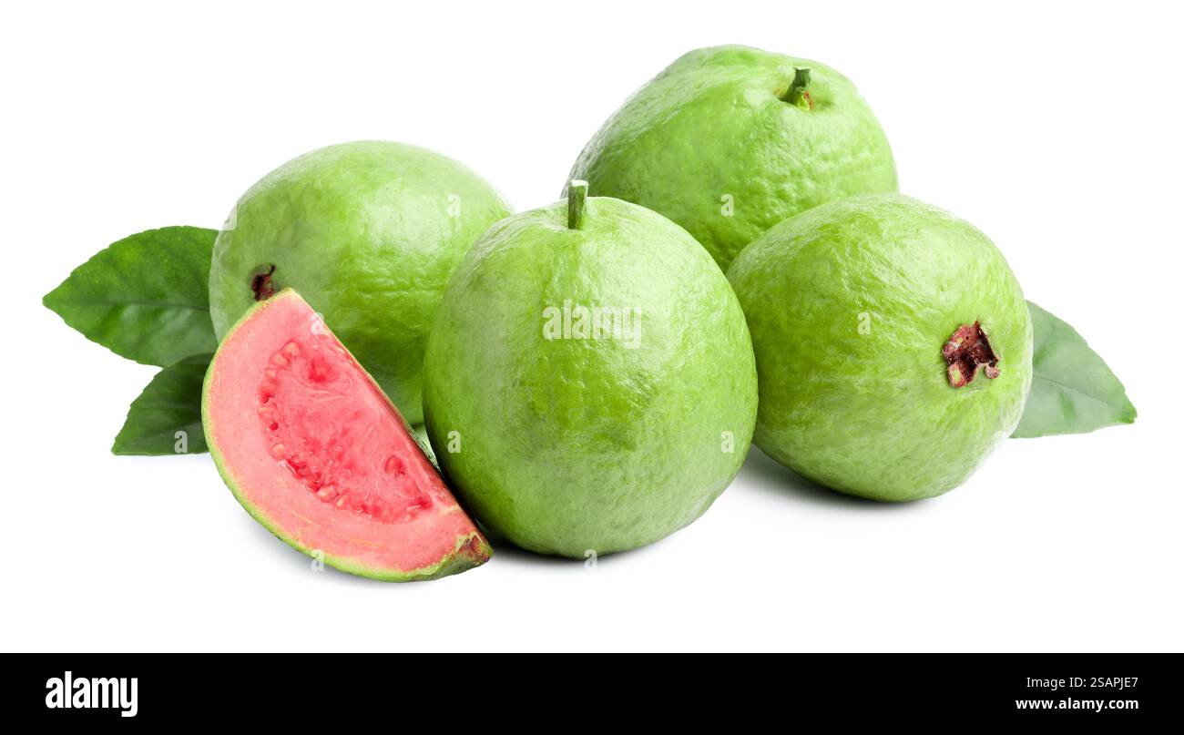 Fresh whole and cut guava fruits with leaves isolated on white Stock ...