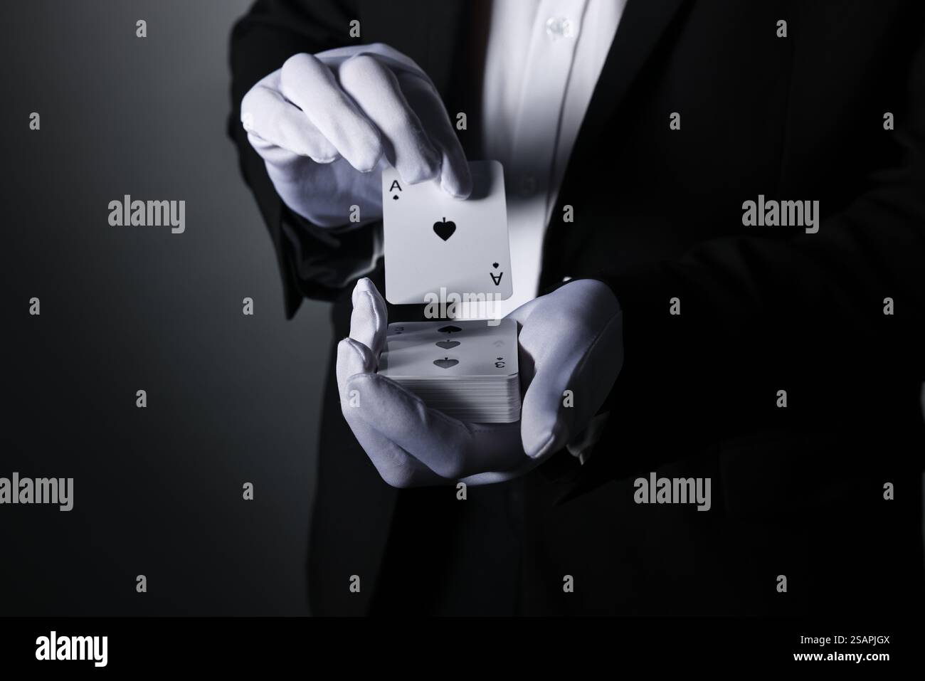 Illusionist shuffling playing cards on grey background, closeup Stock ...