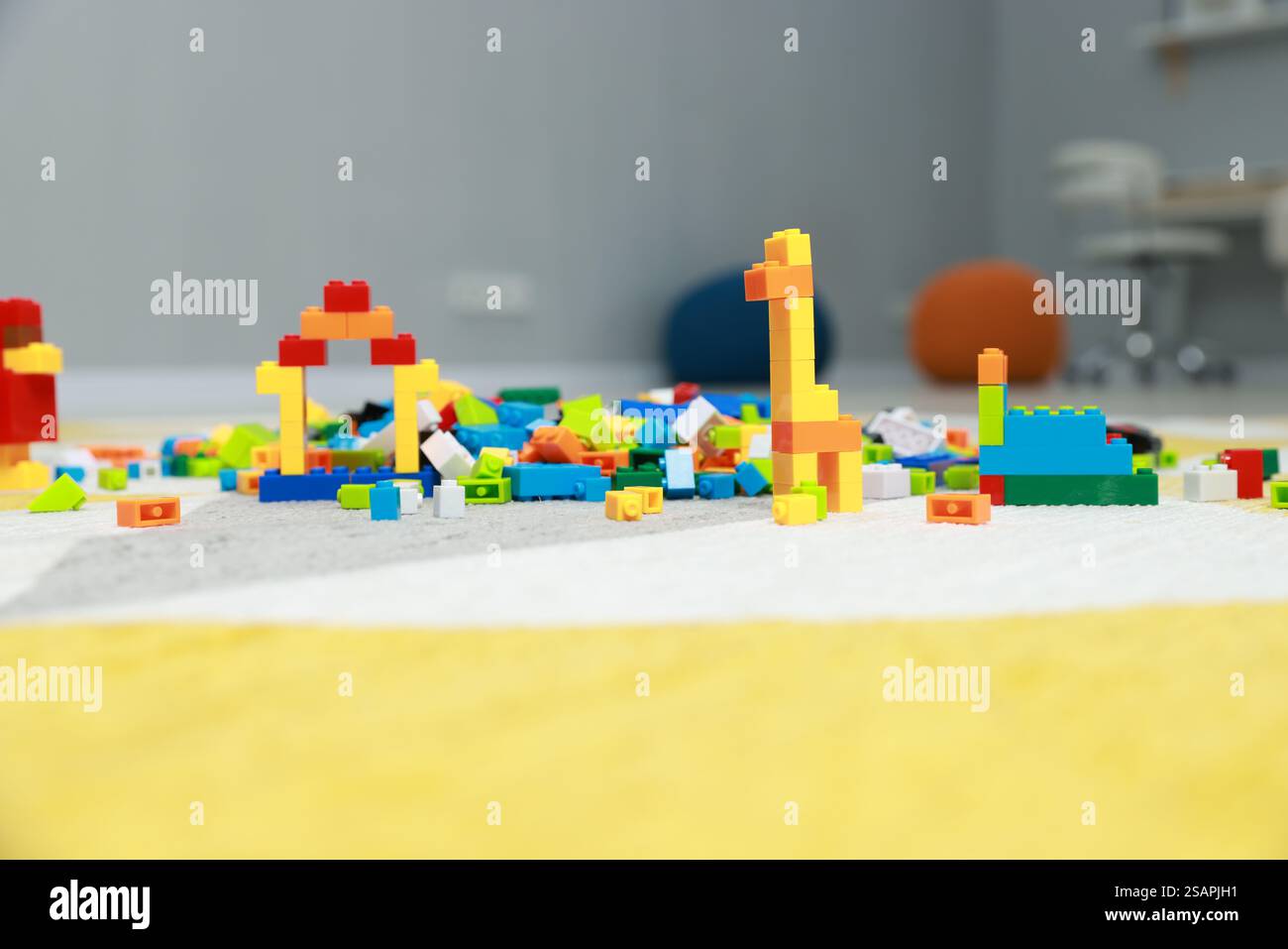 Construction toy. Figures made with building bricks and colorful blocks ...