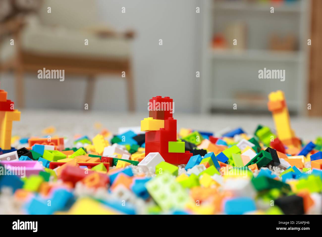 Construction toy. Figure made with building bricks and colorful blocks ...