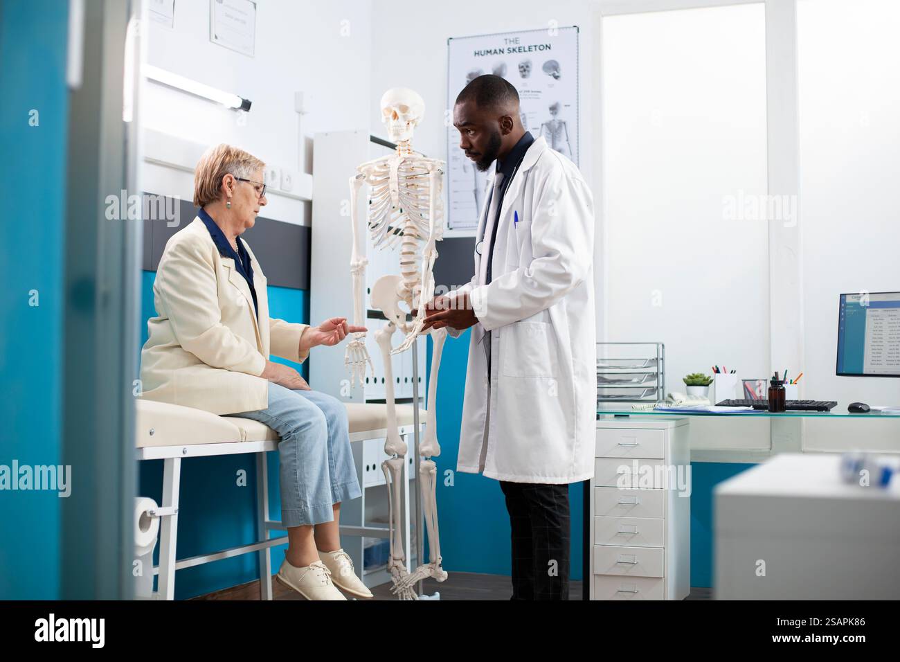 Black doctor discusses anatomy and medical solutions with caucasian ...