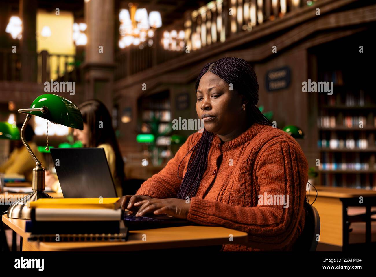 African american positive librarian working in a peaceful public ...